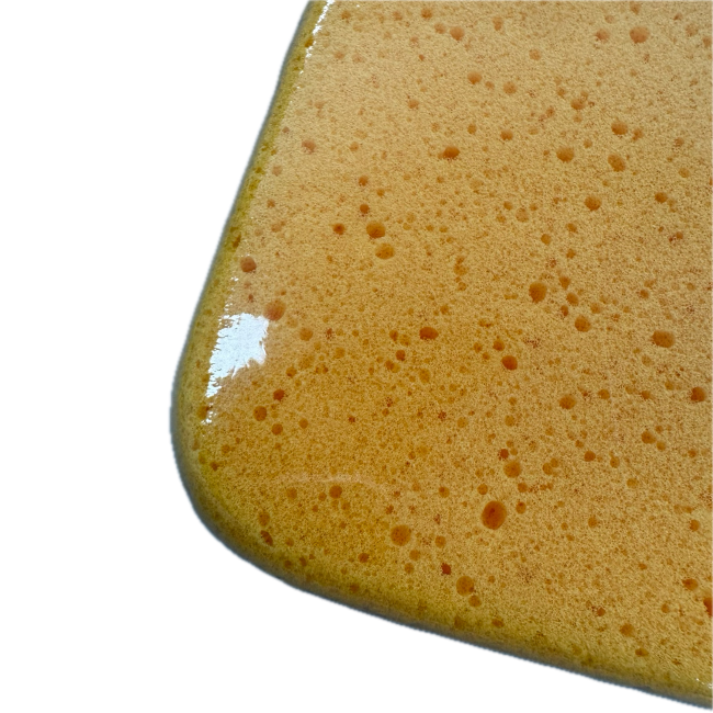 Close-up view of cleaning sponge for tile surfaces
