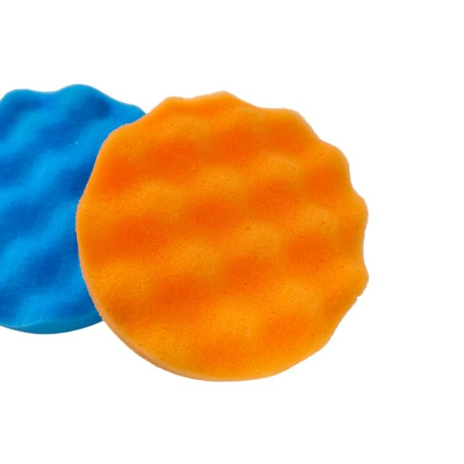 Polishing pad in use on car surface