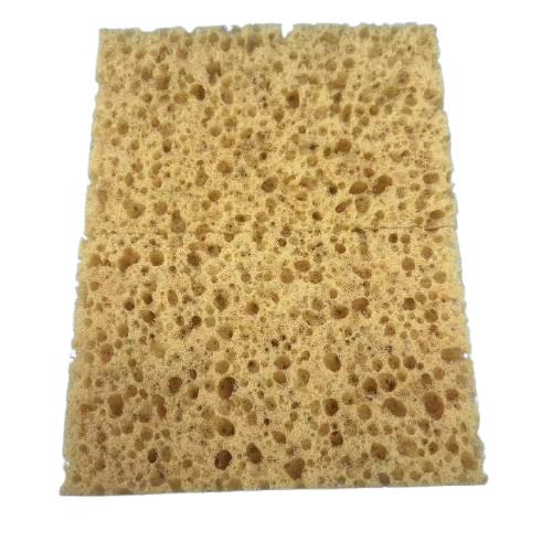 Close-up of sponge cleaning a car surface