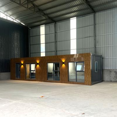 China Casa de contêineres pré-fabricada de 40FT com painéis solares Casa modular de design moderno à prova de furacão à venda