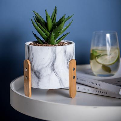 中国 大理石模様をつけることはタケ フィートの小型鍋が付いている植木鉢のSucculentsの鍋プランターのあたりのセメントの植物の鍋を織る 販売のため