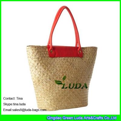 Cina LUDA red leather decoration summer seagrass straw handbags for women in vendita