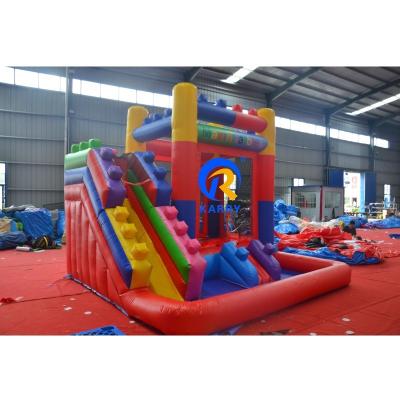 China Crossover Building Block Castle Inflatable Bounce House with Slide 13 x 12 x 14.5 Feet for sale