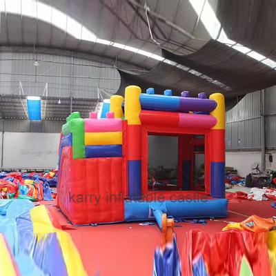 China Commercial Jumping Castle Combo with Inflatable PVC Building Blocks and Slide for sale