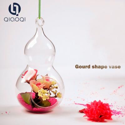 China The gourd shape oblique opening transparent glass vase for sale