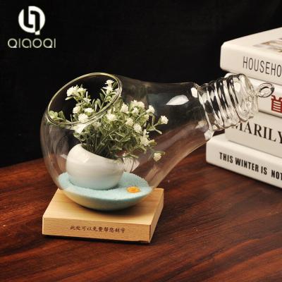 China Creative bulb shape hanging glass vase with wood base for sale