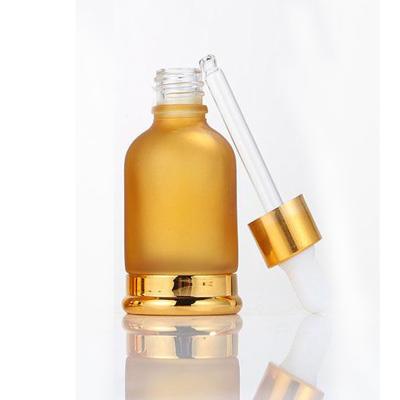 Cina Luxury Gold Dropper Frosted Glass Essential Oil Bottle Round Shape in vendita