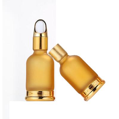 Cina Luxury Gold Dropper Frosted Glass Essential Oil Bottle Round Shape in vendita