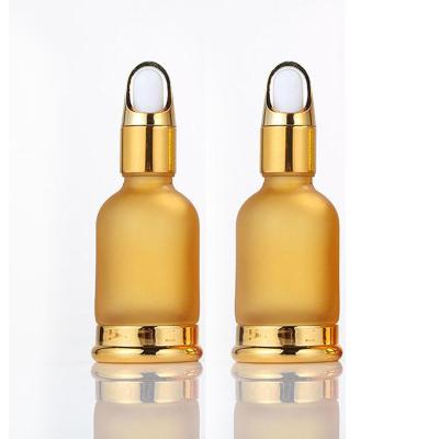 Cina Luxury Gold Dropper Frosted Glass Essential Oil Bottle Round Shape in vendita