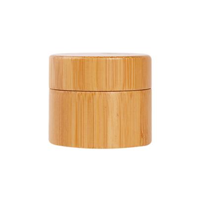 Cina Wooden Bamboo Jar Packaging 5g 15g 30g 50g 100g 200g Clear Frosted Glass Jar in vendita