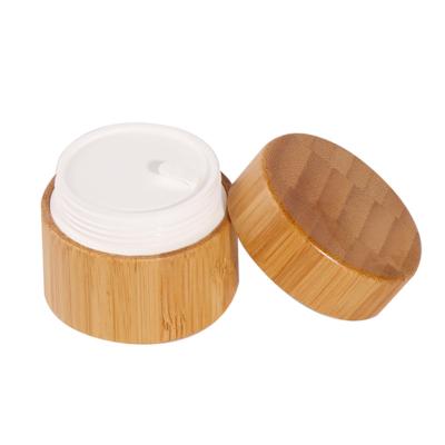 Cina Wooden Bamboo Jar Packaging 5g 15g 30g 50g 100g 200g Clear Frosted Glass Jar in vendita