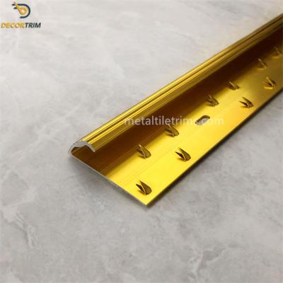 China Carpet Edge Trim Carpet Transition Strip Goud 7.7mm × 38mm Gripper Punching Te koop