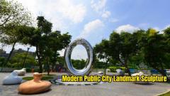 This circular public sculpture stands in the park becoming a  recognizable landmark