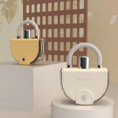 China 100ml Glass Perfume Bottles Handbag Shaped Leather Rope Handle Spray Empty for sale