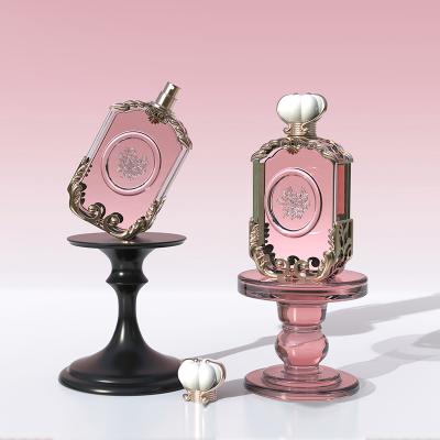 China Unique Perfume Bottles 100ml Glass Pink Metal Frame Pumpkin Cap Empty Spray Luxury for sale