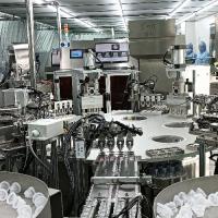 China Turntable Type Infusion Bottle Double-Fold Cap Assembly Machine for sale