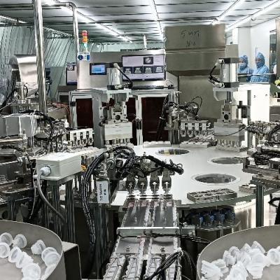 中国 ターンテーブルタイプ 注入ボトル ダブル 折りたたみキャップ 組立マシン 販売のため