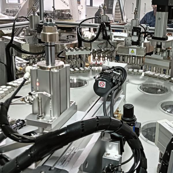 Customised indexed motion heli cap assembly machine with easy to use touch screen operation