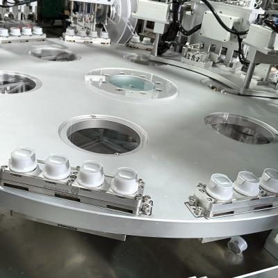 China Automated Assembly Machine For Infusion Film Caps Vibratory Tray Feeding Index Motion Transport for sale