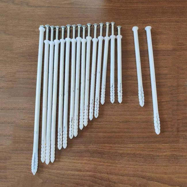 Plastic expansion anchor with mating screw nail