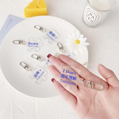 China 2mm Thickness Transparent Acrylic Keychain Metal Ring Customized Design Acrylic Letter Keychain for sale