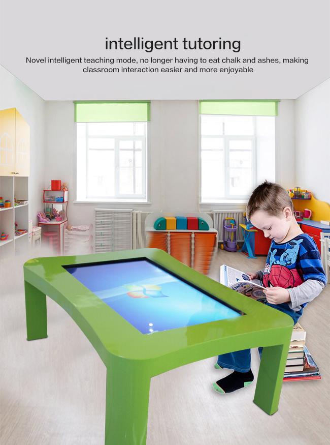 Children using interactive table for learning