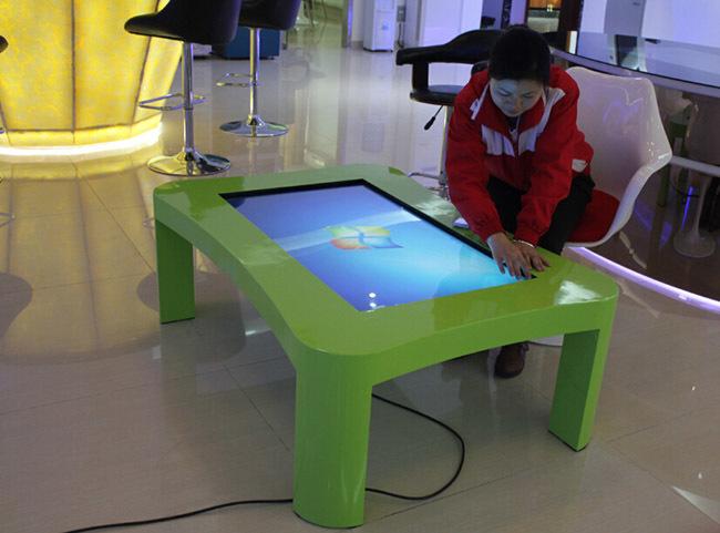 Parent and child using interactive table together