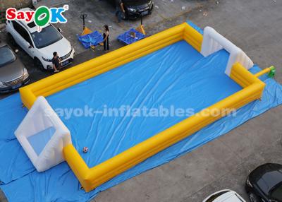 China Riesige aufblasbare Fußball 12*6m gelbe aufblasbare Sportspiel-aufblasbarer Fußballplatz PVCs for sale