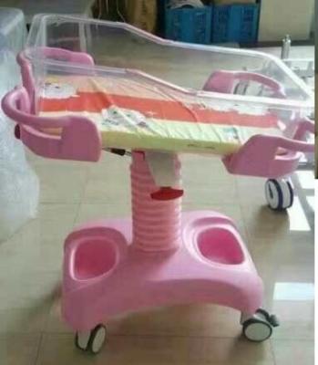 China Transparent Plastic Nursery Hospital Infant Bassinet Trolley Baby Cot With Mattress for sale