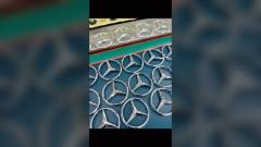Display of the finished product after the vehicle logo undergoes vacuum coating process