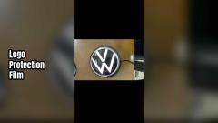 The car logo is coated with protective film