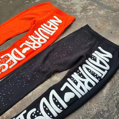 Cina Pantaloni da sudore stampati in strass su misura Corridori Vintage Acid Wash Pantaloni da sudore gonfiabili Uomini in vendita