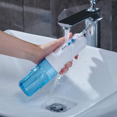 China Mini oral irrigator with folding design compact size dental water flosser for sale