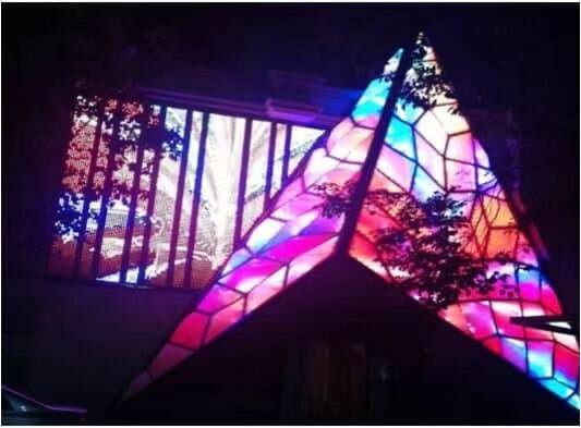 LED Mesh Screen displaying vibrant colors in night environment