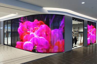 China High Definition P2.6 4000-4500cd 500*1000mm Led Grid Screen Full Color Window Transparent Advertising Translucent Led Grid Screen Display for sale