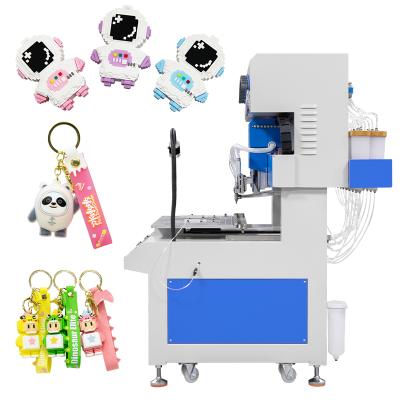 China Automatic 18 Colors PVC Silicone Keychain Making Machine with 0.01mm XYZ Accuracy and 220V Input Voltage for sale