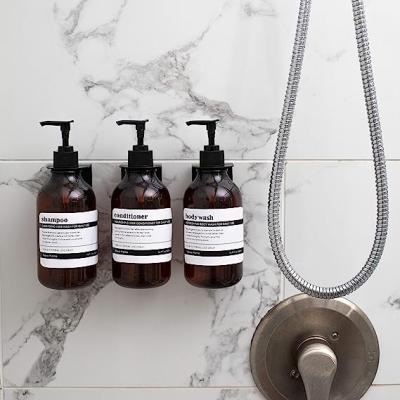 Cina Tenitore di bottiglie adesivo per lo shampoo a risparmio di spazio set di 2 dietro le porte/su pareti in vendita