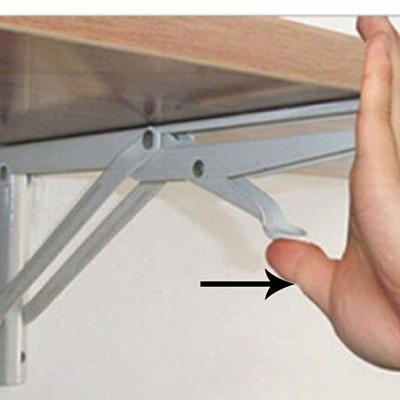 China Custom Triangle Spring Folding Shelf Locking Hinge Bracket for Wall Mounting in Silver for sale