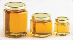China hexagonal glass jars for honey for sale