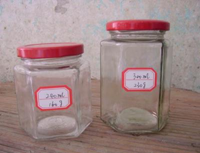 China 240ml 300ml hexagon glass jar for honey for sale