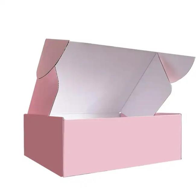 Custom corrugated mailer gift box with pink color and paperboard liner