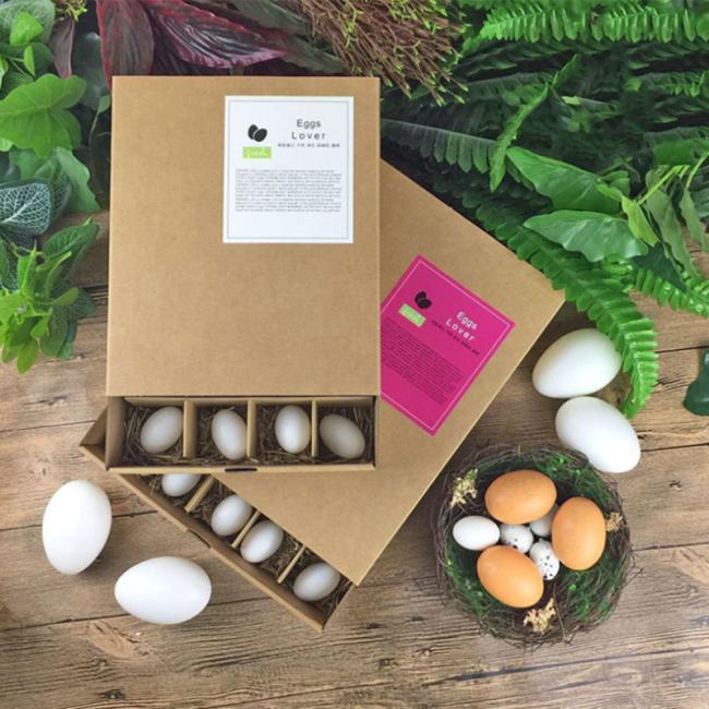 Multiple egg boxes stacked showing packaging efficiency