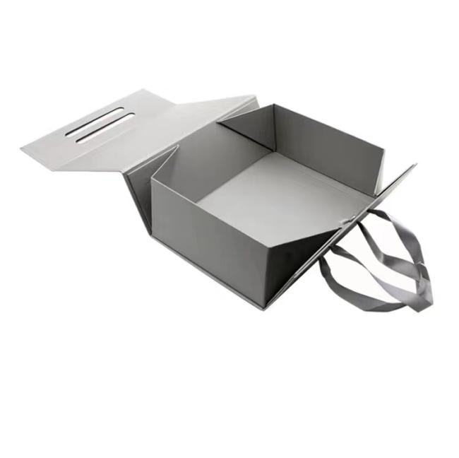 Close-up of magnetic closure mechanism on cardboard gift box