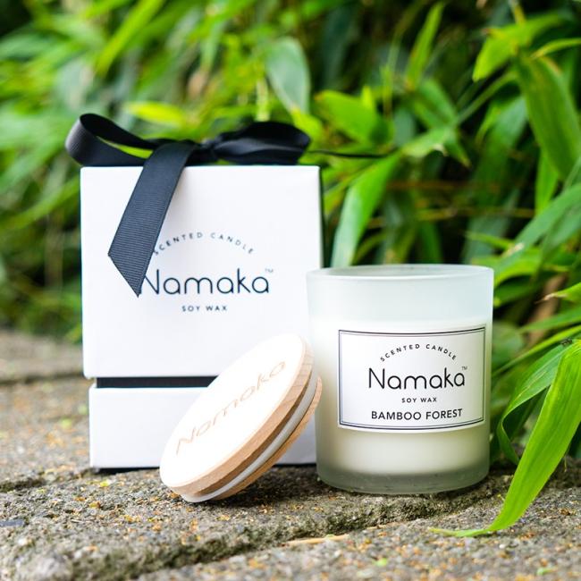 Luxury candle box with embossed logo and ribbon detail