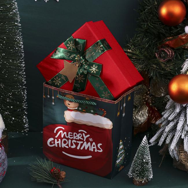 Christmas gift box packaging with decorative ribbon - side view