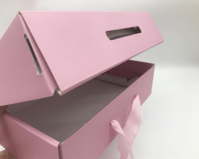 Assorted colored mailer boxes for garment storage