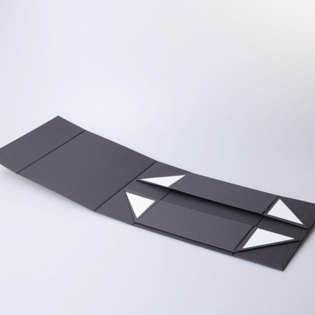 Magnetic closure detail of black paper foldable box