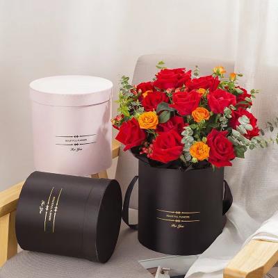 中国 CMYK 丸いゴールドフォイル ロゴ 黒の花帽子箱 新鮮な花の包装のために手作り 販売のため