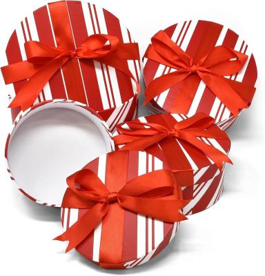 China Artesanía de Navidad redonda Cajas de regalo de anidación con tapas 4 paquete Rojo y blanco para galletas de dulces en venta