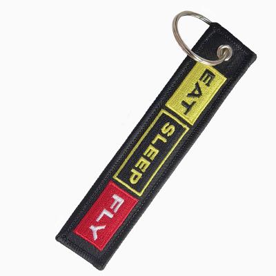 China EAT SLEEP FLY Colorful Letters Double Sided Embroidered Keychain Airplane Keychain Flying Enthusiast Jewelry Accessories for sale